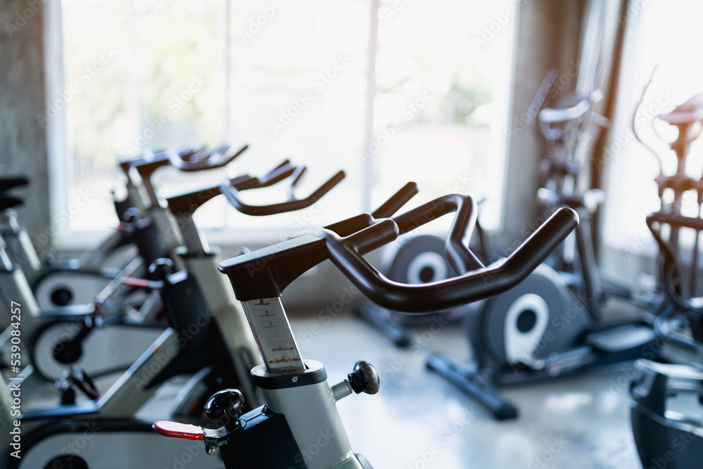Fitness center club with training exercise bikes. Modern gym interior ...