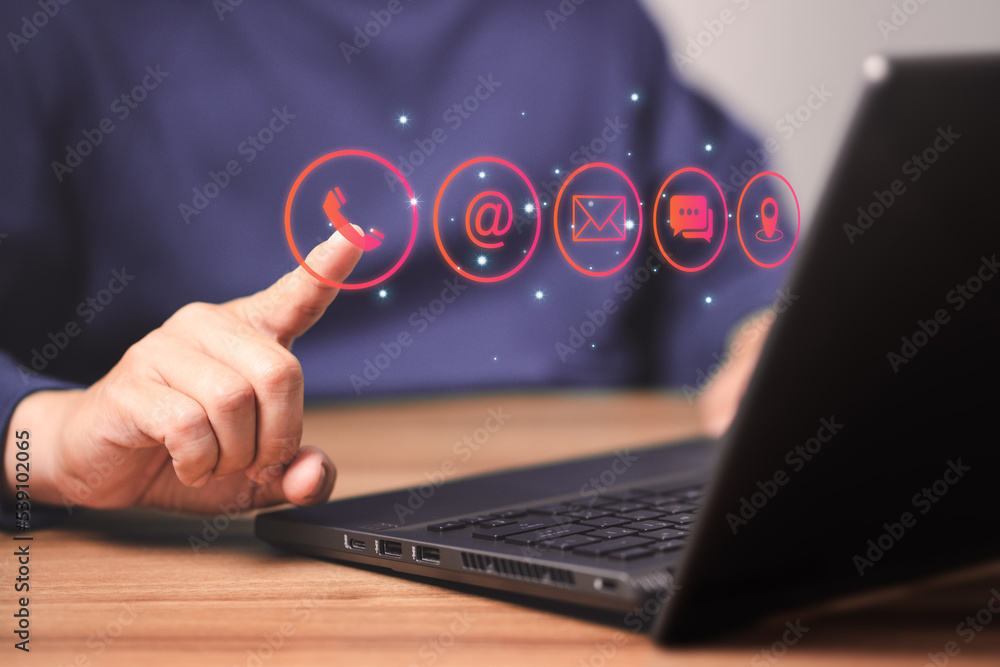 Man using a computer laptop and touching on technology virtual screen ...