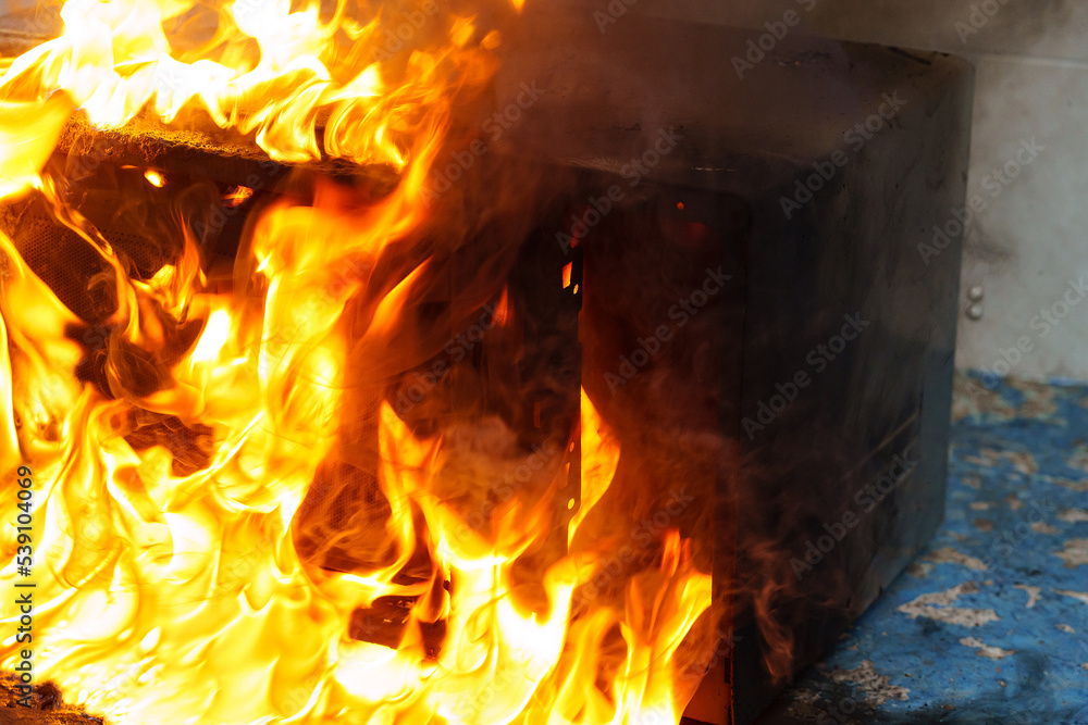 microwave oven on fire. the concept of fire in the kitchen and ...