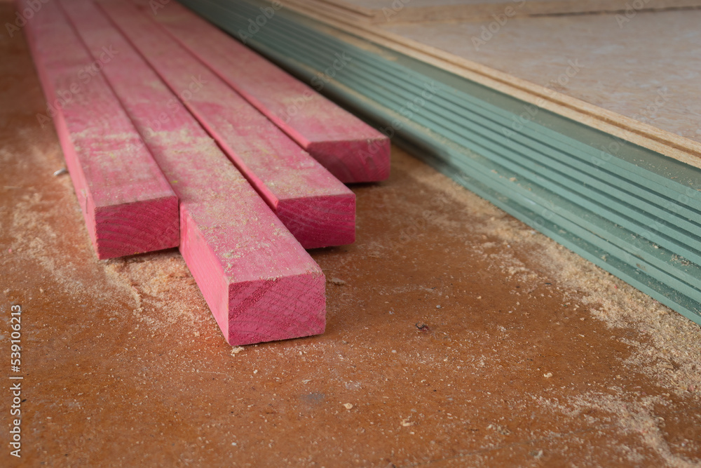 Building timber and GIB plasterboards with saw dust around. Home ...