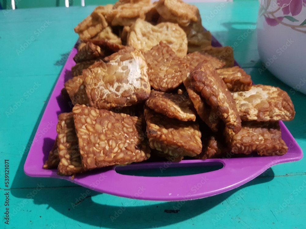 Deep fried tempeh or Tempe Mendoan, is a traditional food made from ...