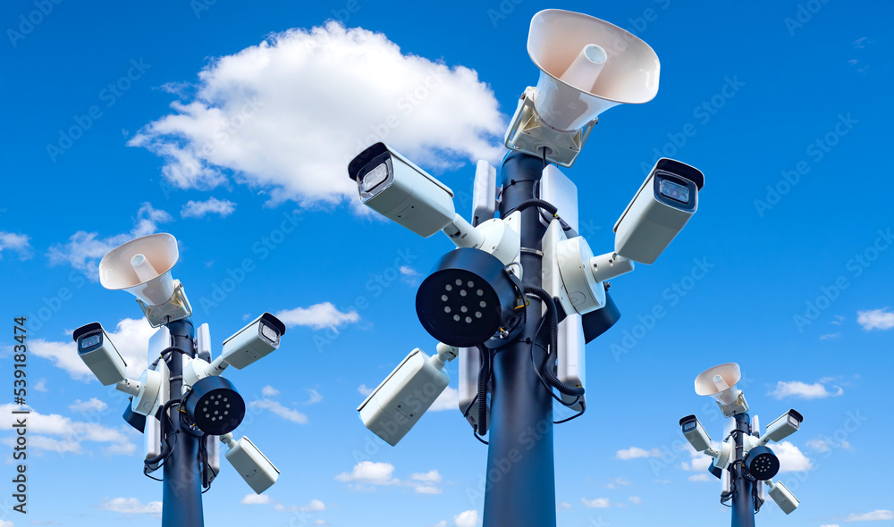 Street poles with cameras. City warning system. Big brother concept ...