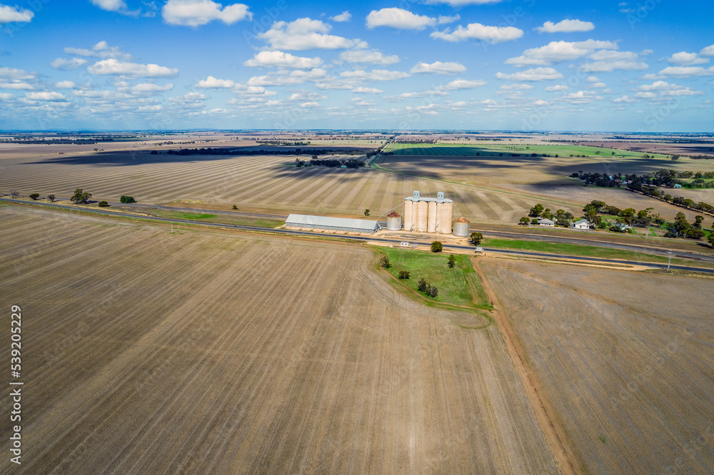 Looking at the silos, grain storage and the railway line in the remote ...