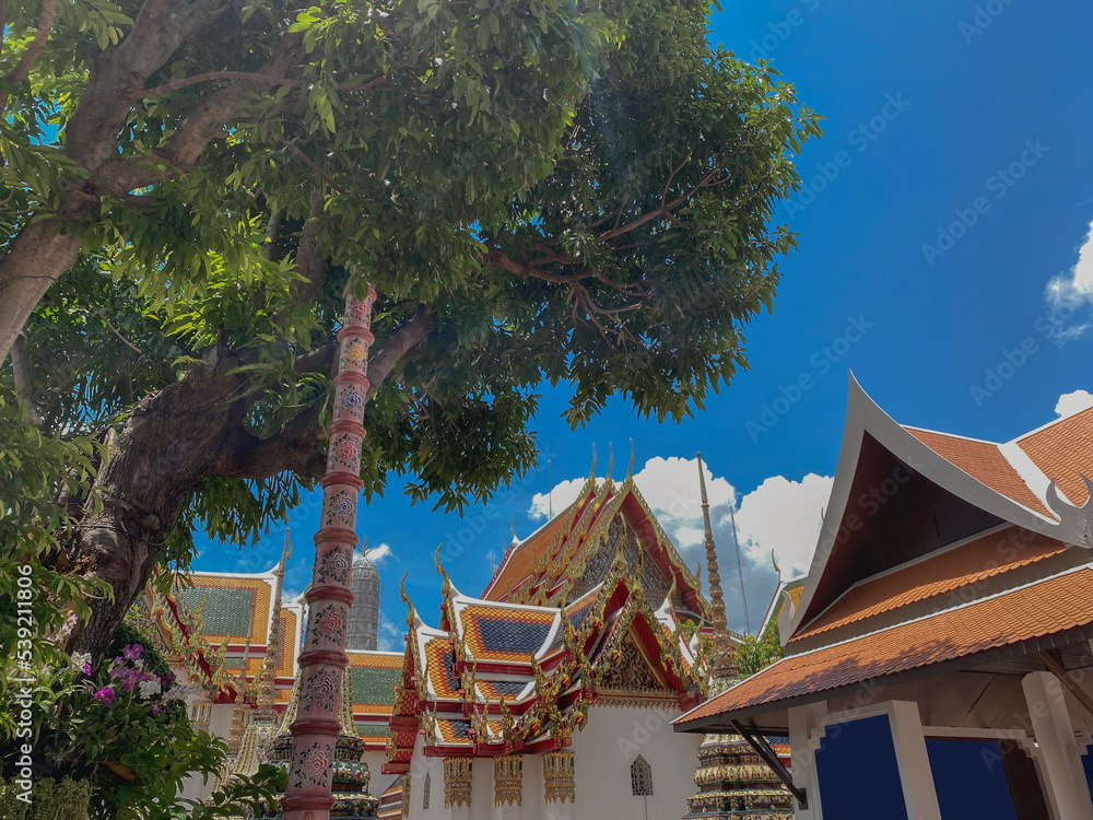 Wat Arun Temple in Bangkok, Thailand with stone pyramid towers, golden ...