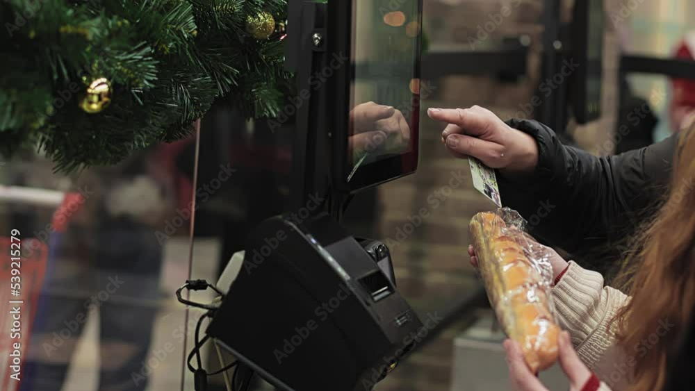 Customer uses touch panel at self-service checkout ACO. Buyer manually ...