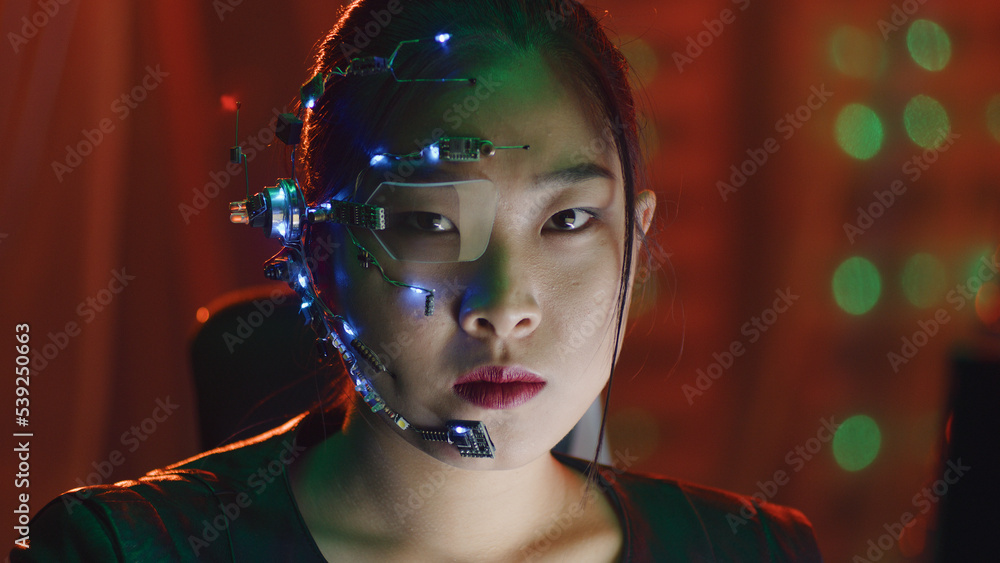 Asian girl in cyberpunk style wearing one-eyed glasses and microphone ...
