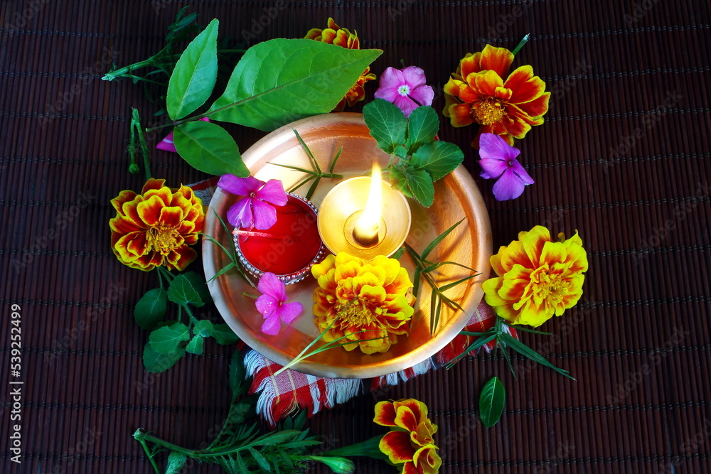 Traditional indian hindu puja thali with flower, kumkum,diya (oil lamp ...