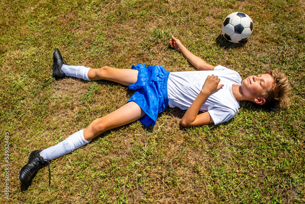 Child Youth Boy Soccer Player Laying on Soccer Field Unconscious Stock ...