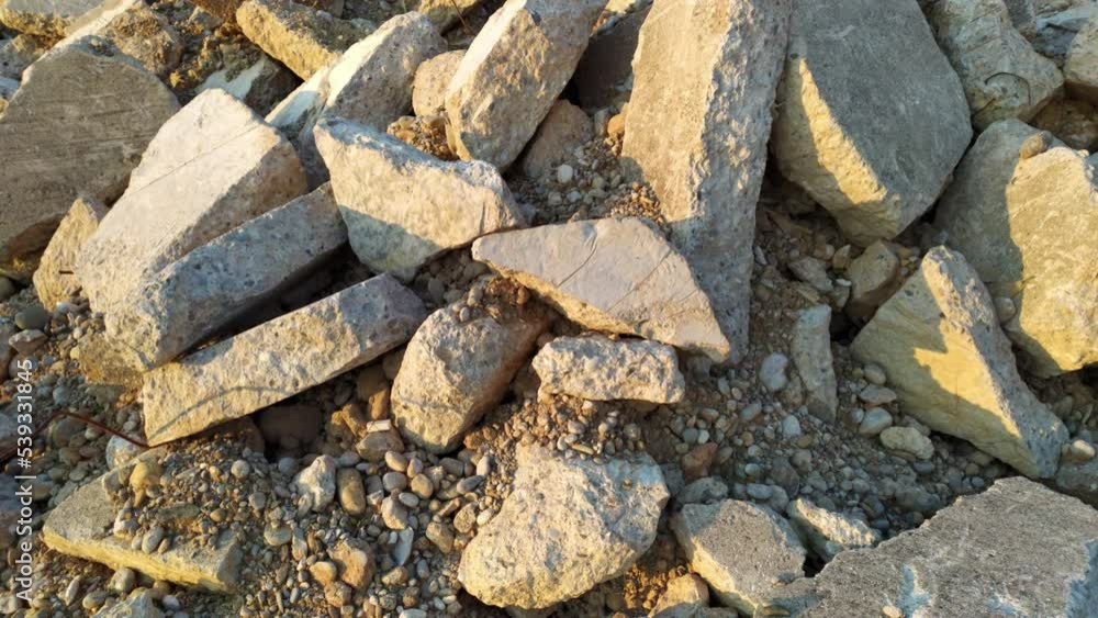 Rubble on the demolition site of a reinforced concrete building. Pile ...