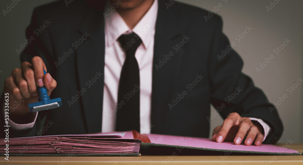 Businessman person with a stamp of approval on a public notarization ...