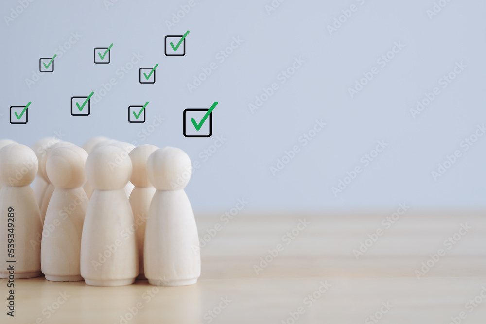 Elections and Voting concept. Wooden figure with green check mark ...