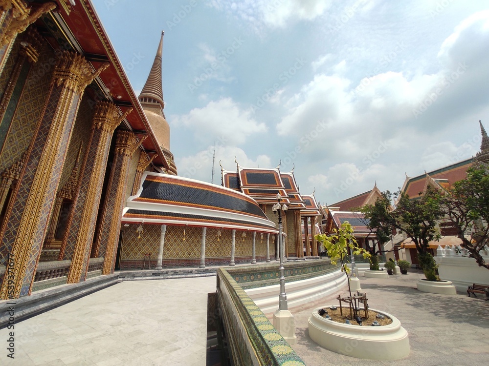 Golden pagoda and the curved walkway around the circular cloister of ...