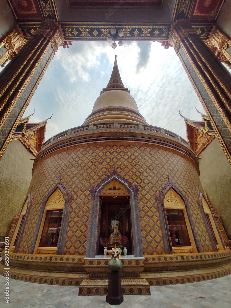 Wide angle of golden pagoda and the curved walkway around the circular ...