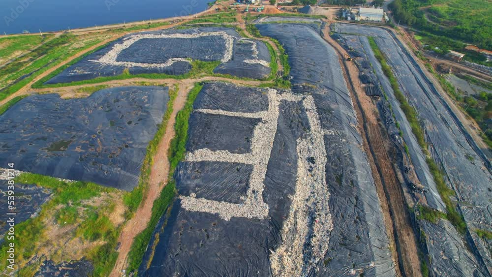 Drones are flying over large garbage pile of plastic waste. Plastic ...