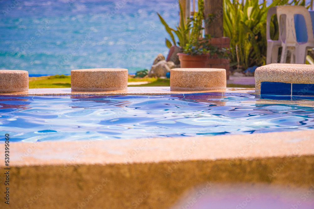 Swimming pool tropical resort spot facing the sea. Summer vacation ...
