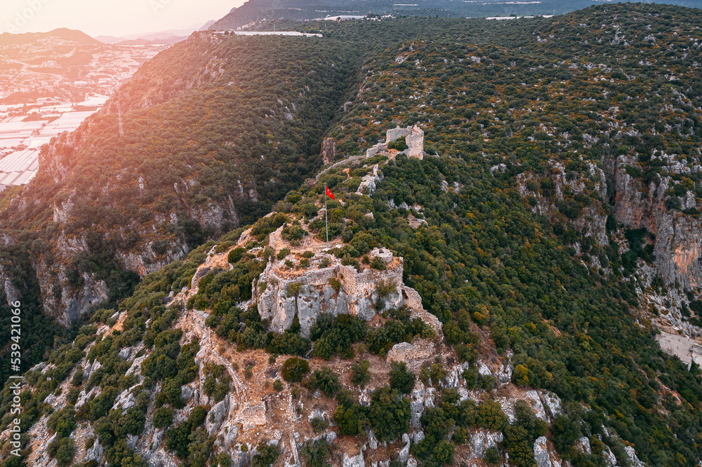 Ruins of ancient city Myra in Demre, Turkey Aerial Top view. Old tombs and amphitheater photo by ...