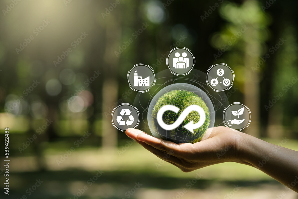 Hand of human holding green earth circular economy icon. Circulating in ...
