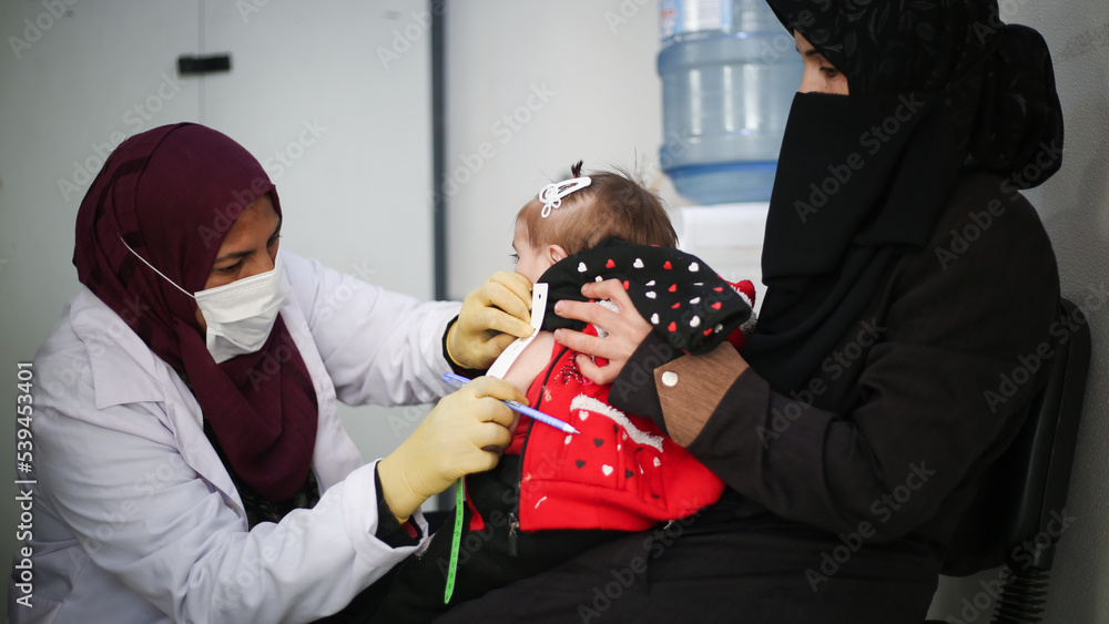 Doctor examines child malnutrition. Measuring malnutrition using strap ...