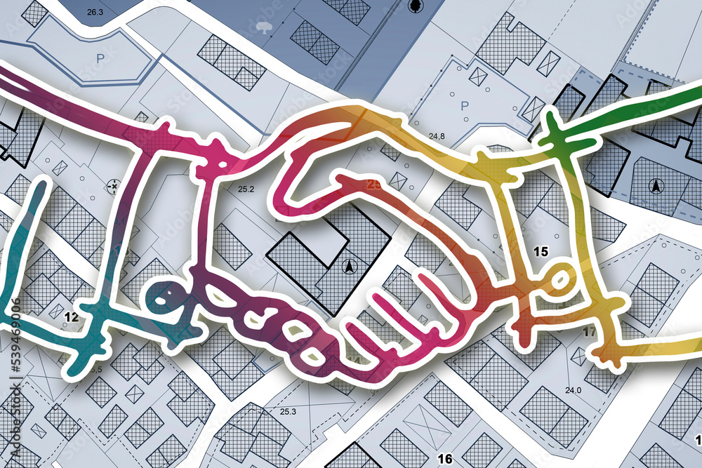 Handshake against an imaginary cadastral map of territory with ...