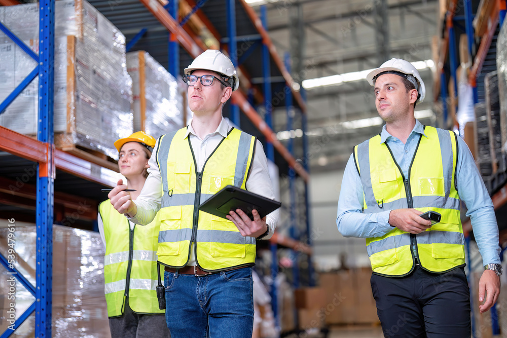 Worker in warehouse hold tablet check list perform inventory stock ...