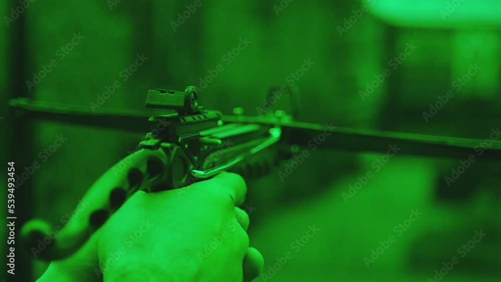 Firing a crossbow . Player or shooter loading arrow in arbalet and ...