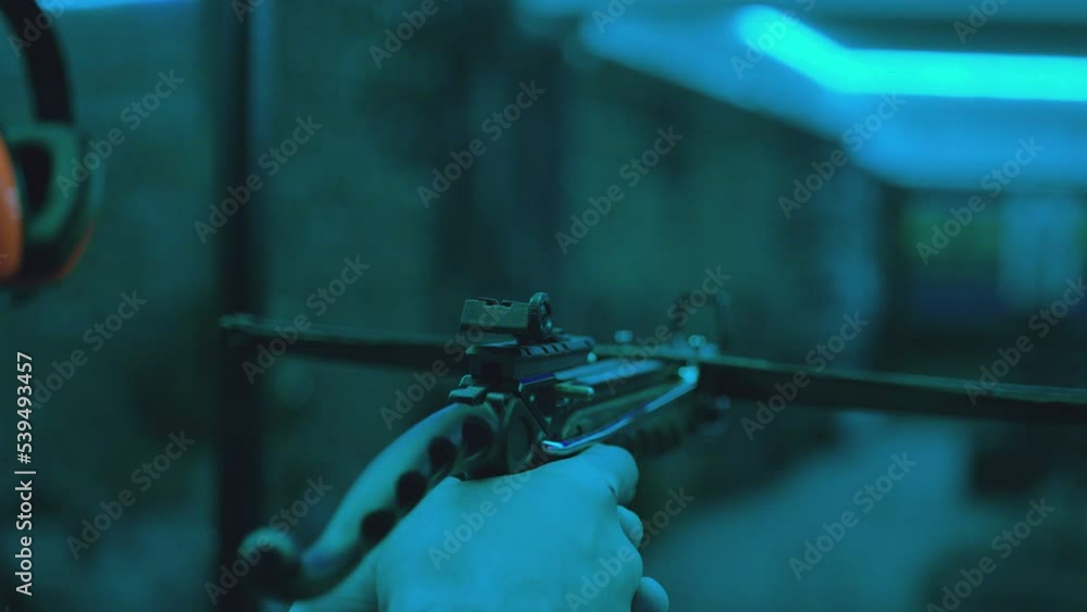 Firing a crossbow . Player or shooter loading arrow in arbalet and ...