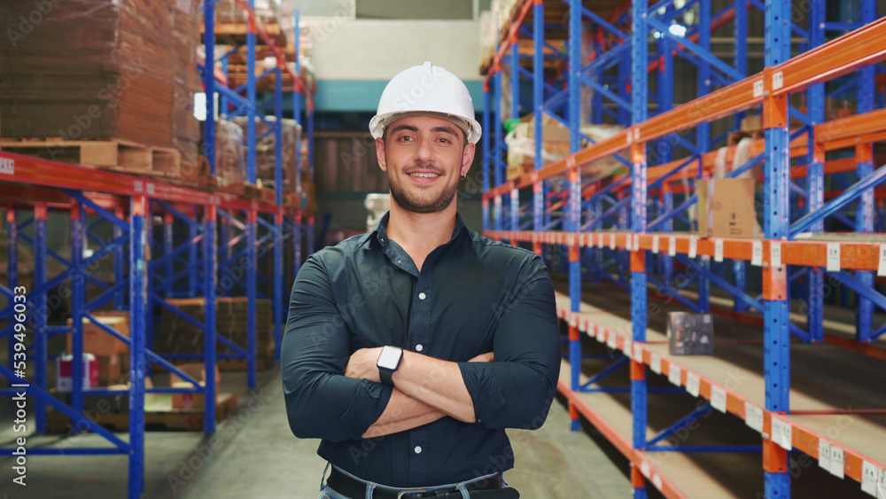 Portrait of Caucasian logistics employee wearing safety hat and ...