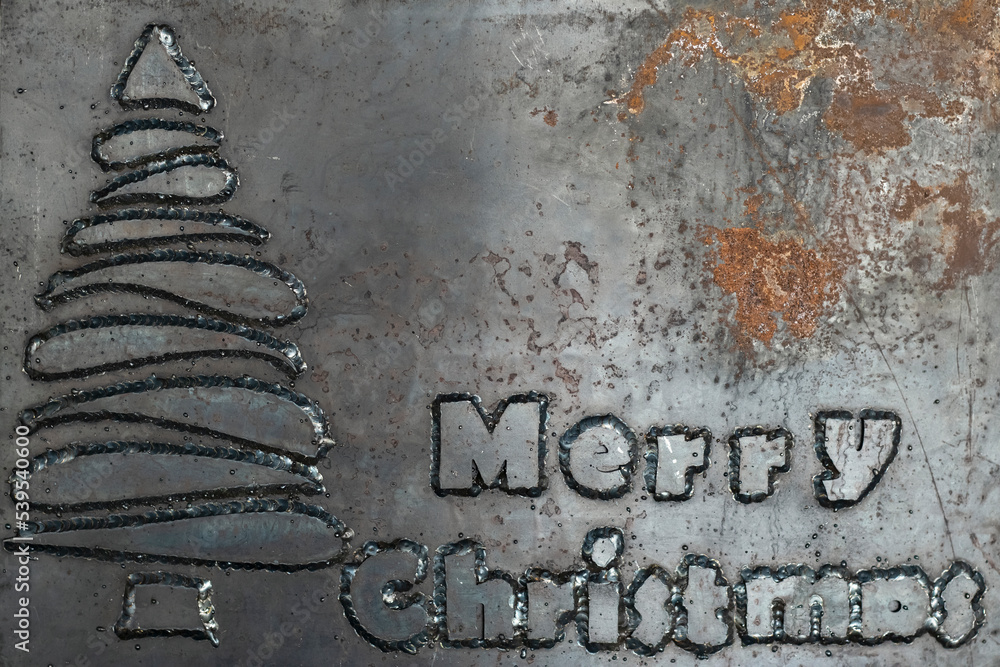Hard phrase merry christmas made from steel letters welded to a steel ...