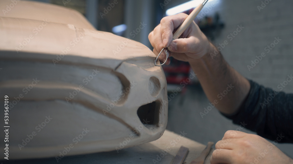 Experienced car designer works on the prototype eco friendly electric ...