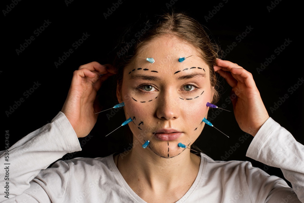 young beautiful girl with deep eyes looking into the camera. needles ...