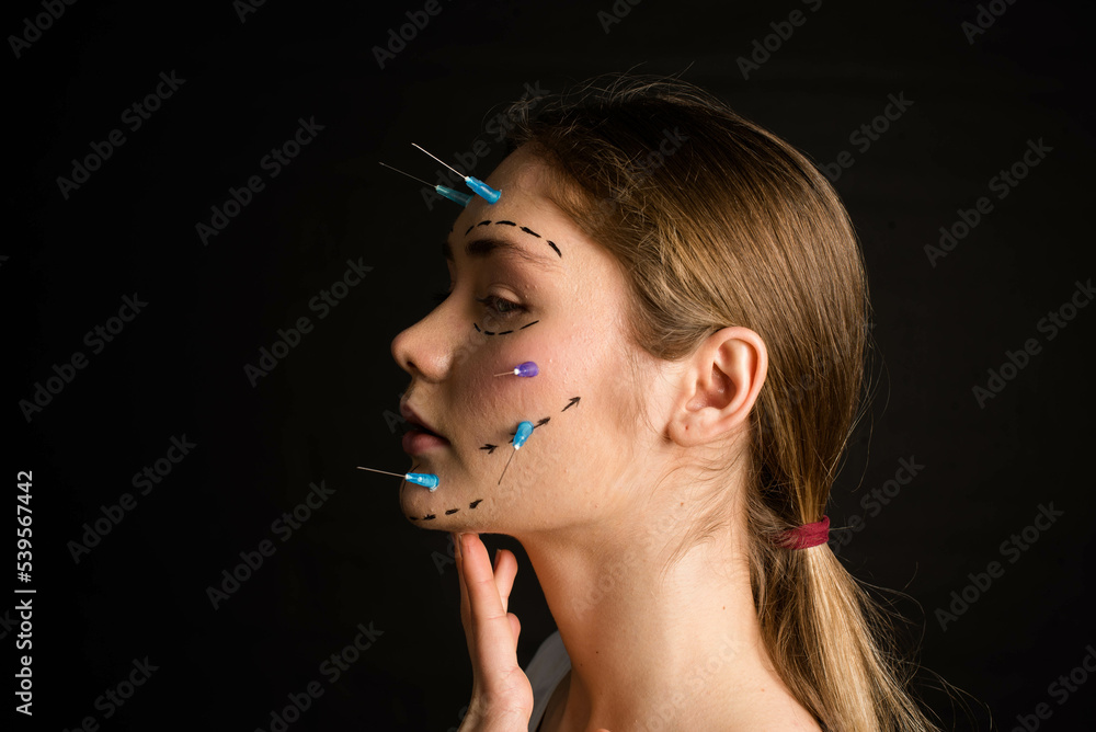 young beautiful girl looking into the camera. needles from syringes on ...
