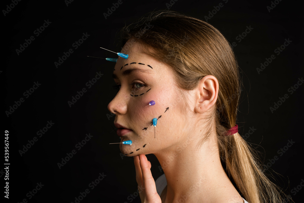 young beautiful girl looking into the camera. needles from syringes on ...