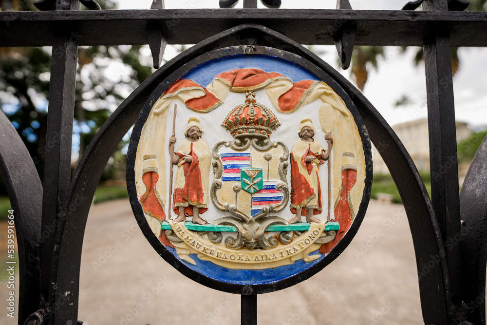 Hawaiian coat of arms on the gates of the Iolani Palace grounds in the ...