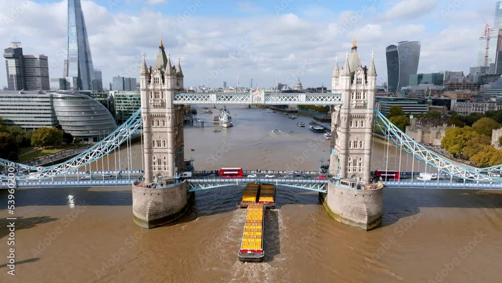 Cargo boat sailing down the river Thames in London right under the ...