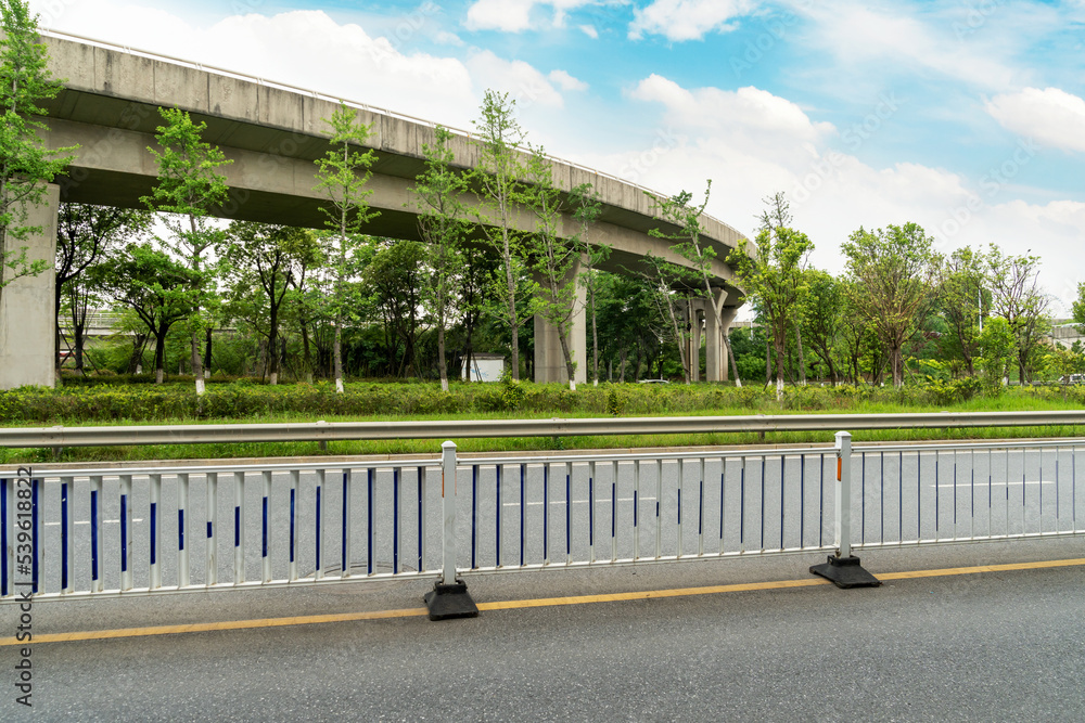 Concrete structure and asphalt road space under the overpass in the ...