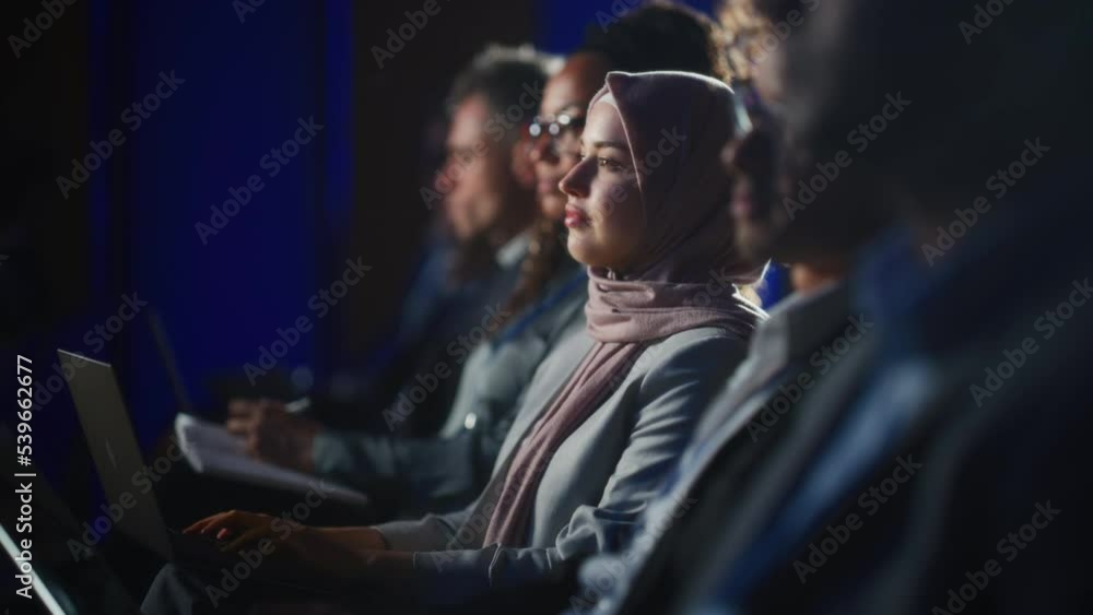 Arab Female Sitting in a Dark Crowded Auditorium at a Human Rights ...
