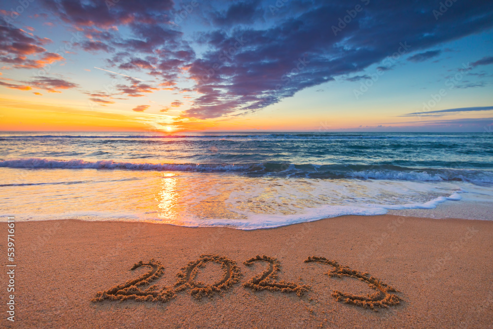 Happy New Year 2023 concept, lettering on the beach. Written text on ...
