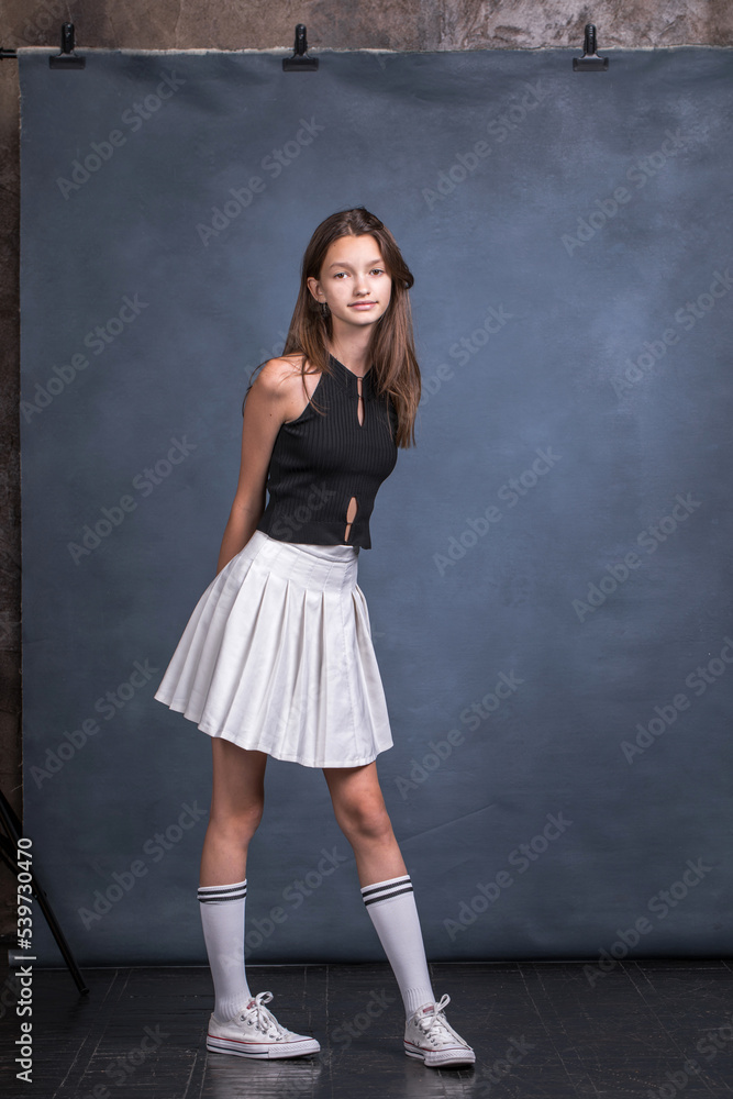 Studio portrait of a young teen girl Stock Photo | Adobe Stock