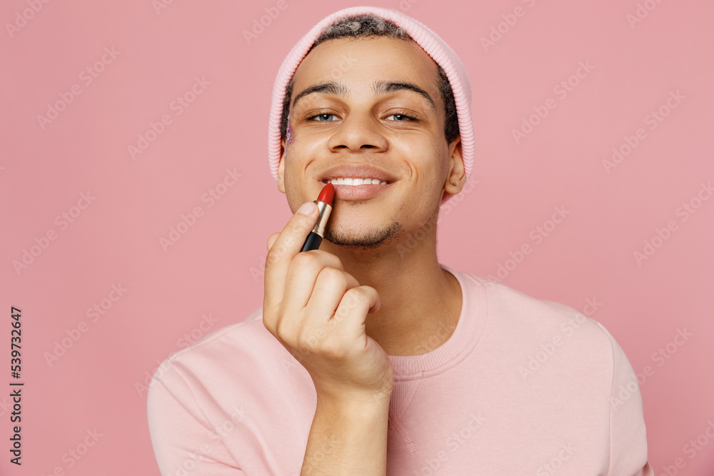 Young flamboyant happy fun attractive gay man wear sweatshirt hat using ...