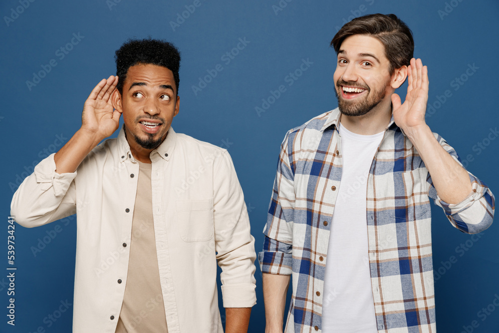 Young two friends curious nosy men wear white casual shirts looking ...