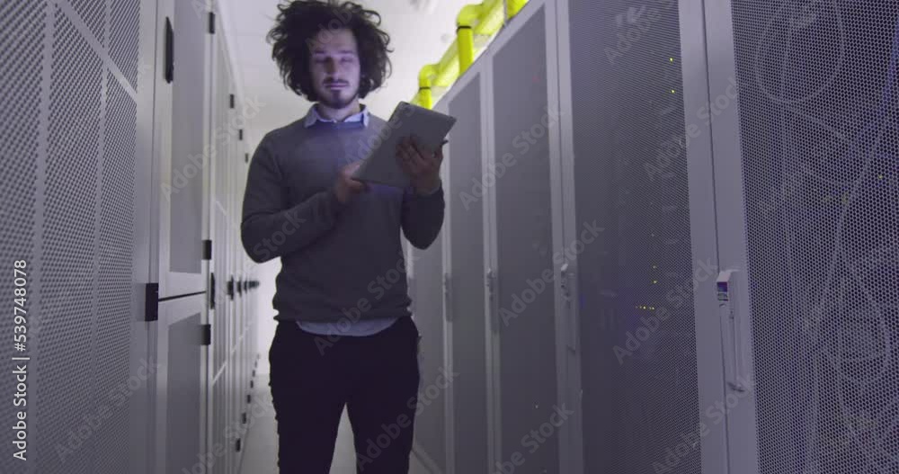 IT engineer or data science specialist working on tablet computer in ...