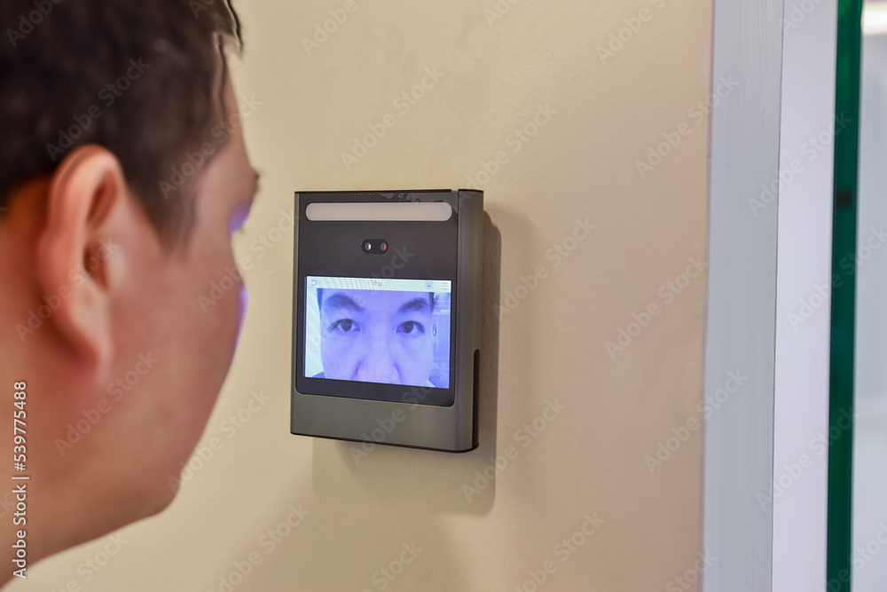 Face scanner machine detect man face to unlock door in office building ...