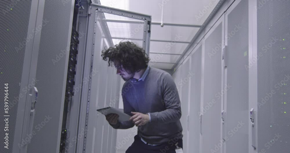 IT engineer or data science specialist working on tablet computer in ...