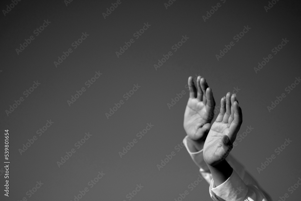 two lover raise hand to the sky as a symbol of love in blackk and white ...