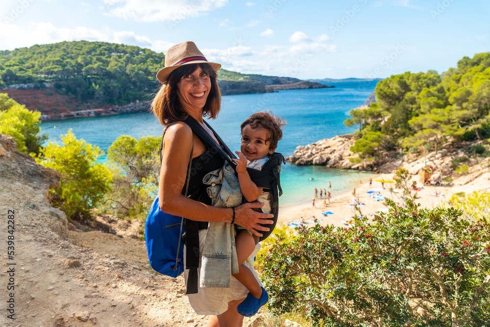 Mother with her son on the paradisiacal beaches on the coast of Ibiza ...