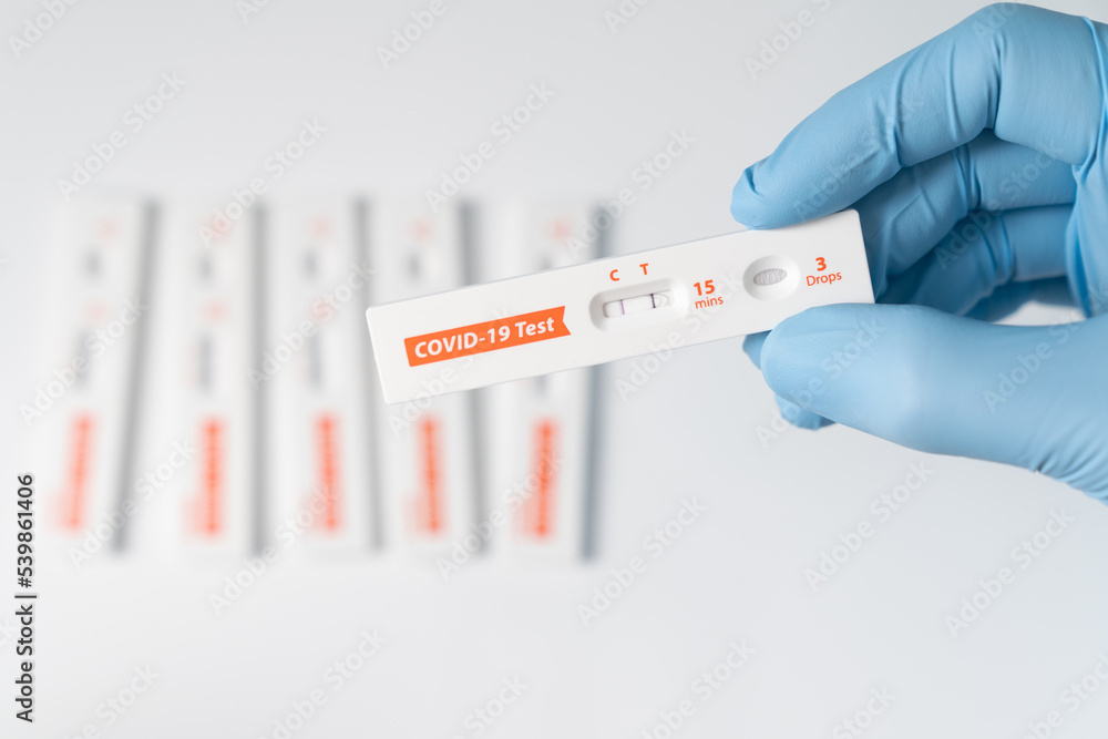 Hand is showing positive results on rapid antigen test kit for covid-19 ...