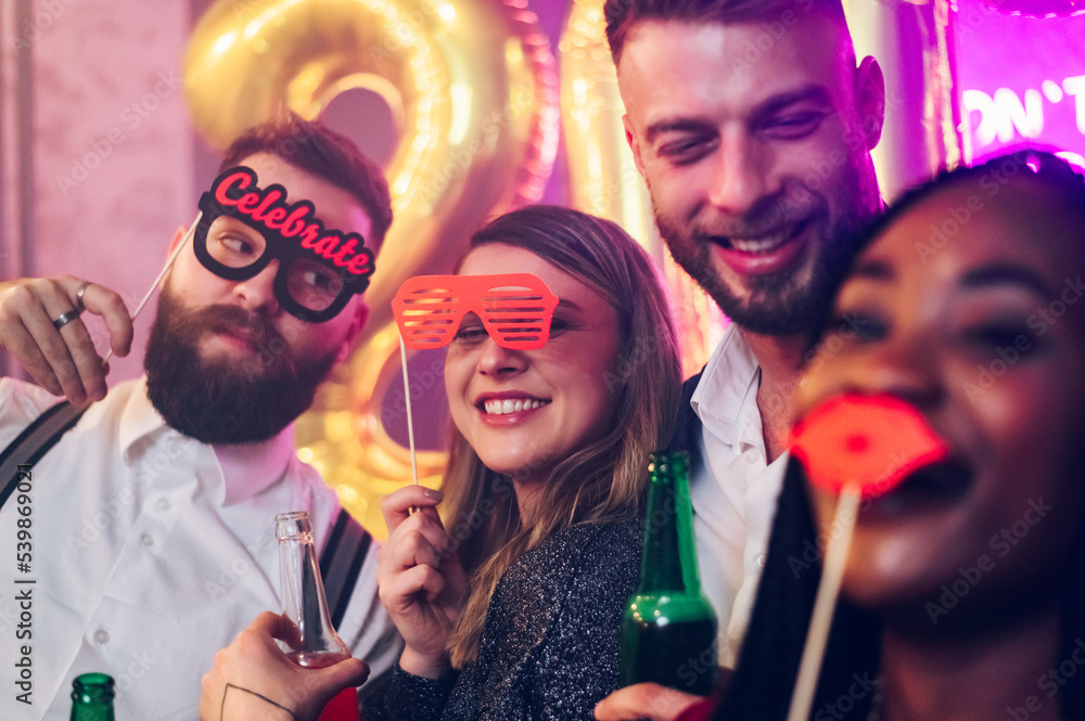Multiracial people celebrating a party, new year's eve or birthday in ...