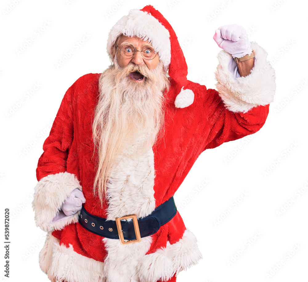 Old senior man with grey hair and long beard wearing traditional santa ...
