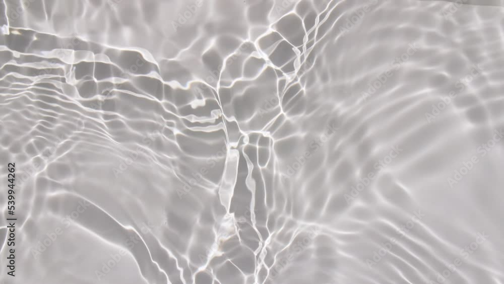 Pure water with reflections sunlight in slow motion. Water surface ...