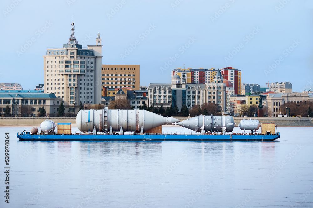 Gas processing equipment on a barge on the Amur River. State border ...
